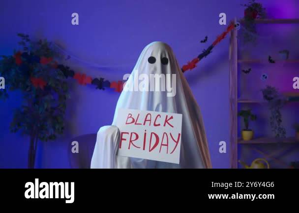 Person dressed as ghost posing at camera. Funny halloween ghost in ...