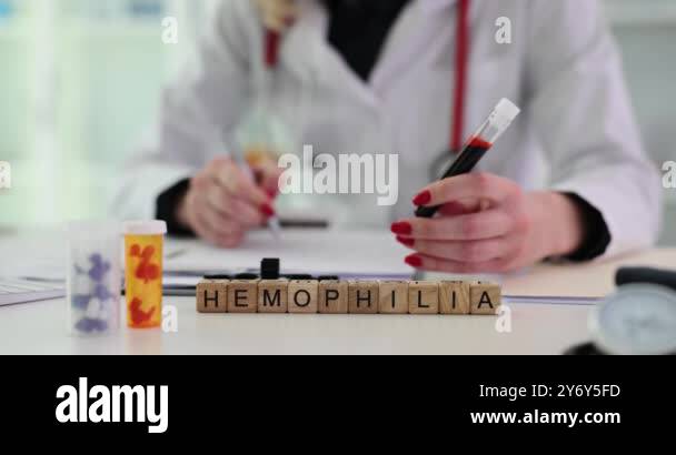 Word Hemophilia from wooden blocks near pill bottles on background of ...