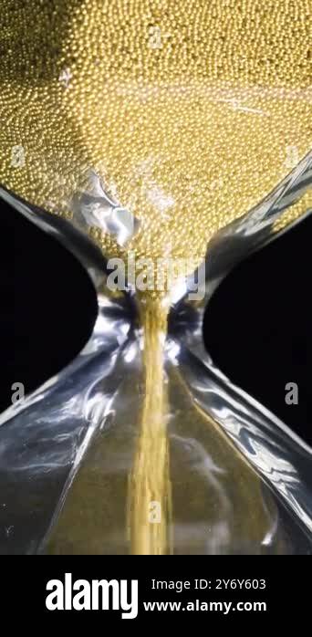 Close-up of golden hourglass. Stock footage. Stylish hexagon hourglass ...