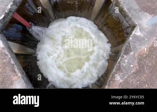 water flowing from a reservoir down into a spillway, footage shows ...