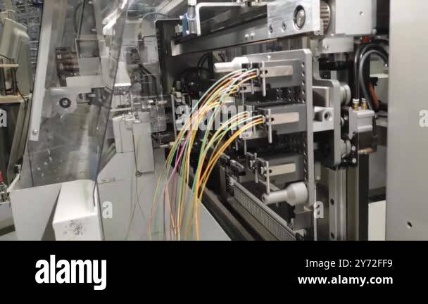 industry Production of auto wiring. Robots are automated. Operator in ...