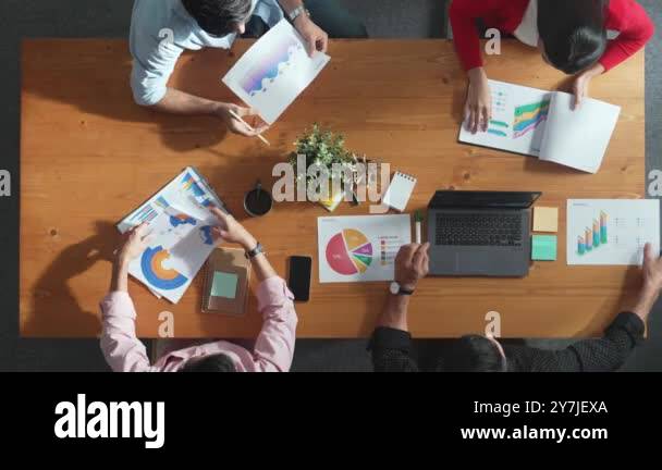 Top down view of business woman explain and present financial chart ...