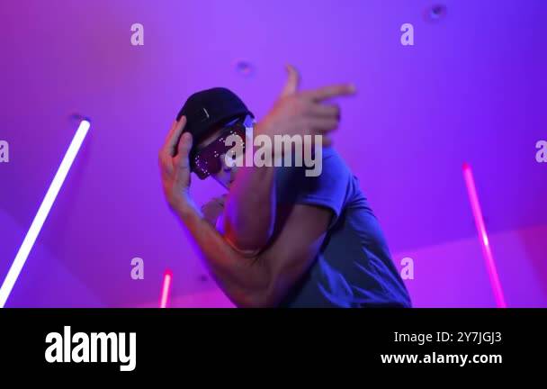 Low angle camera of caucasian dancer wearing fancy glasses and ...