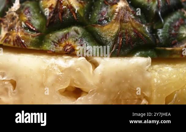 Close up video of fresh pineapple with slice of peel pineapple insert ...