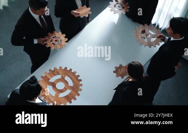 Top view of smart business people gather wooden cog together at meeting ...