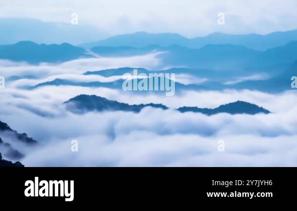 A breathtaking panoramic view of a sea of clouds below a crescent moon and a starry night sky ...