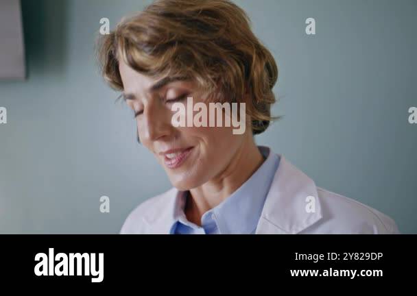 Smiling general practitioner consulting girl patient in modern ...