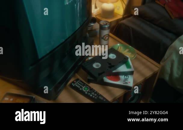 No people top view of cassettes lying on wooden table near remote ...