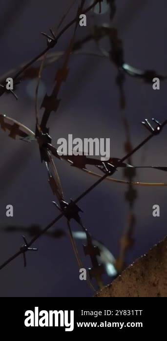 Barbed wire fence details against of the night dramatic sky. Footage ...