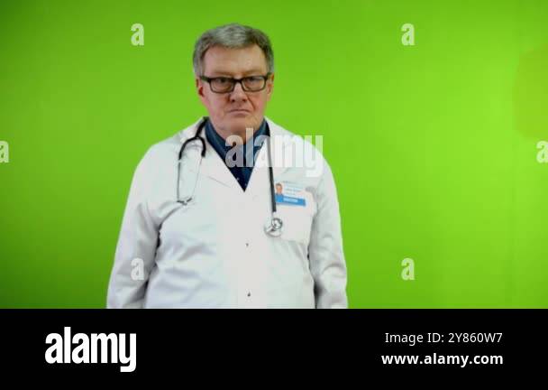 Serious senior doctor says absolutely no, and disagree. Green screen ...