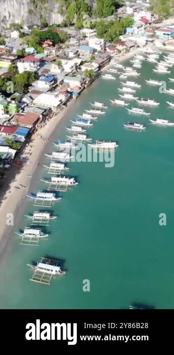 Vertical drone footage captured at sunrise in May showing the city area ...
