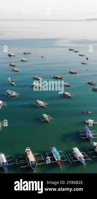 Vertical drone footage captured at sunrise in May showing the city area ...