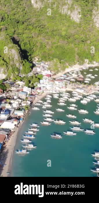Vertical drone footage captured at sunrise in May showing the city area ...