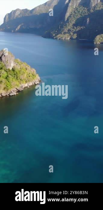 Vertical drone footage captured at sunrise in May showing the city area ...