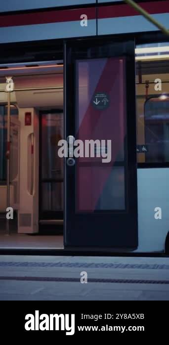 A scene from a train station captures the closing doors of a modern ...