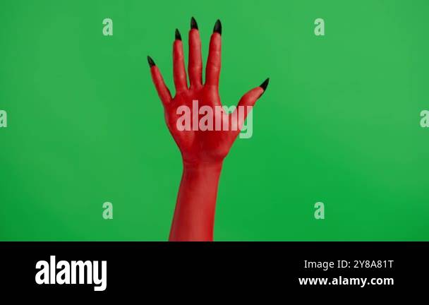 Scary hand showing gestures in studio. Creepy halloween devil monster ...