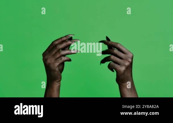 Scary hand showing gestures in studio. Creepy halloween devil monster ...