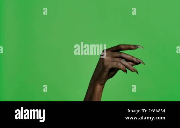 Scary hand showing gestures in studio. Creepy halloween devil monster ...