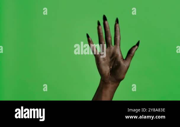 Scary hand showing gestures in studio. Creepy halloween devil monster ...