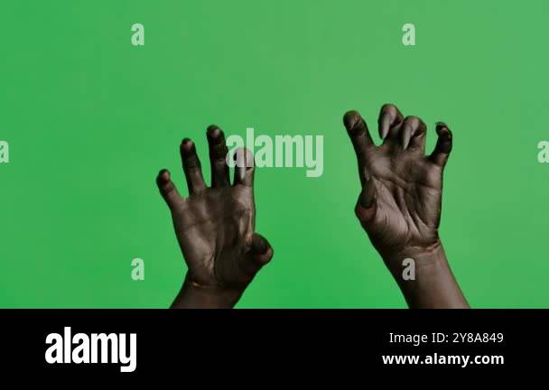 Scary hand showing gestures in studio. Creepy halloween devil monster ...