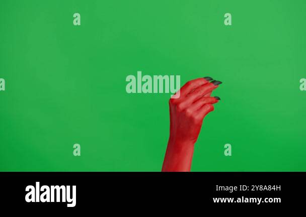 Scary hand showing gestures in studio. Creepy halloween devil monster ...
