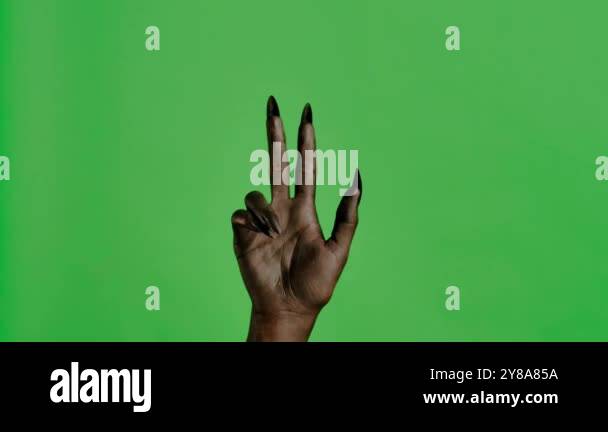 Scary hand showing gestures in studio. Creepy halloween devil monster ...