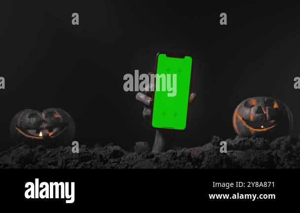 Creepy monster hand in graveyard. Scary halloween zombie hand raising ...