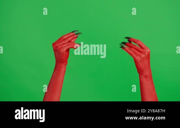 Scary hand showing gestures in studio. Creepy halloween devil monster ...