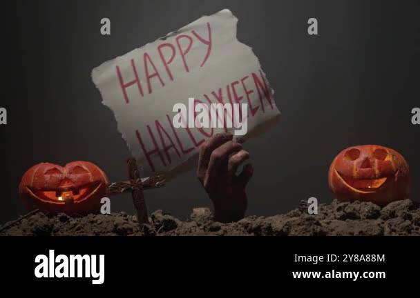 Creepy monster hand shows gestures in graveyard. Scary halloween zombie ...