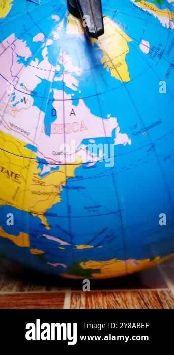 Globe flipping dynamically as symbol of changing climate, economy ...