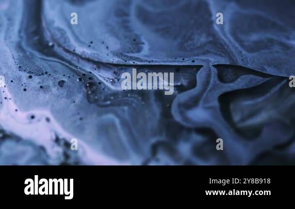 Fluid glitter drip. Bubble paint spill. Defocused neon blue black white ...