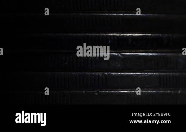Stack of coins in close-up, texture of old coins, dark background ...