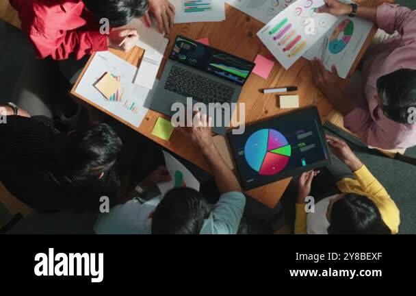 Top view of business team working together while talking about financial chart. Close up of ...