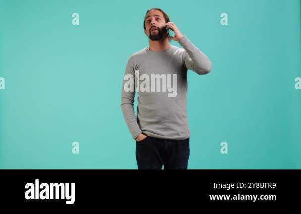 Man discussing with best friend over telephone call using smartphone ...