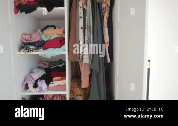 A wellorganized, tidy wardrobe that beautifully showcases neatly folded ...