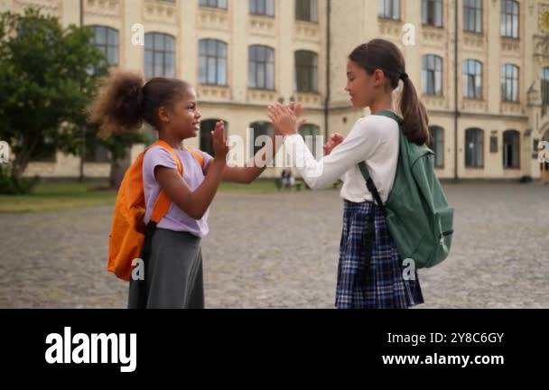 Multiethnic schoolgirls kids with backpacks pupils students elementary ...
