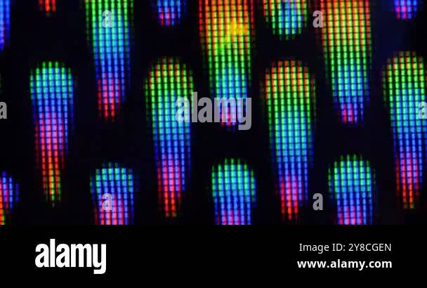 Extreme macro view of 4K LED matrix red, blue, and green sub-pixels ...