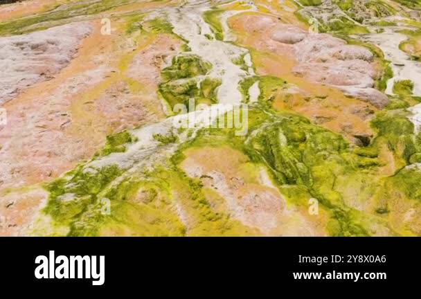 Boiling geothermal hot springs covered with sulfur and volcanic ...