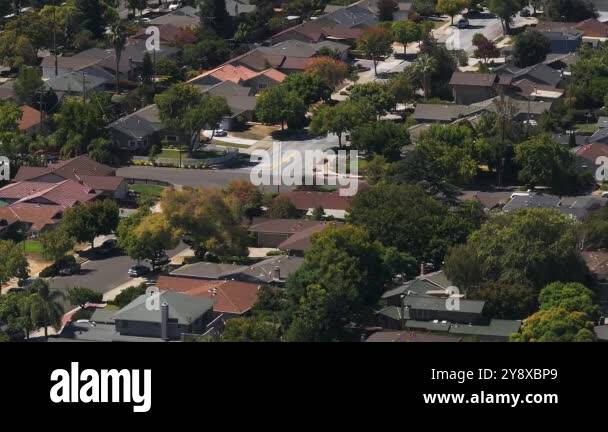 Residential street in new development neighborhood subdivision with row ...