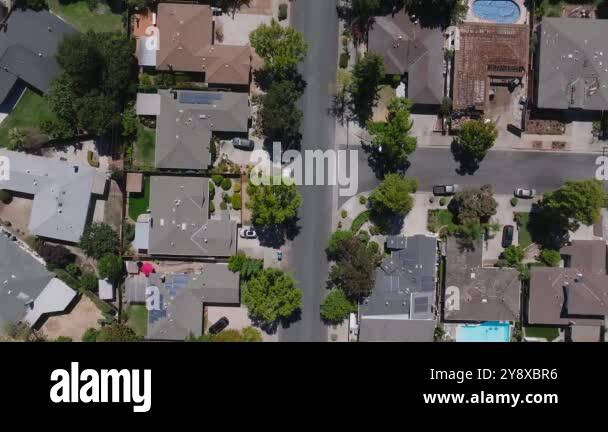 Residential street in new development neighborhood subdivision with row ...