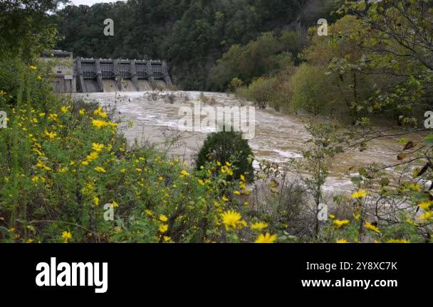 Fort Patrick Henry Dam, spilling, muddy flood waters from four ...