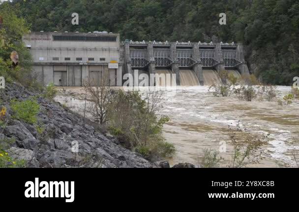 Fort Patrick Henry Dam, spilling, muddy flood waters from four ...