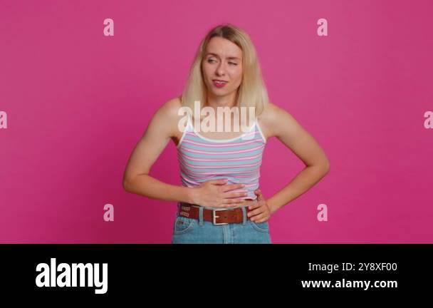 Sick ill young woman suffering from period cramps, painful stomach ache ...