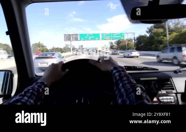 Point of view from inside a car driving toward Los Angeles and Long ...