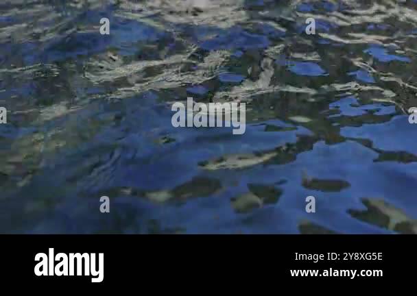 Natural background of blue water surface of sea or ocean with waves and ...