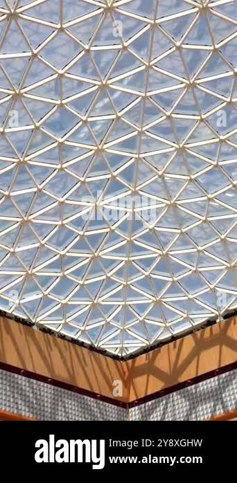 Geometric ceiling structure with triangular glass design showcasing ...