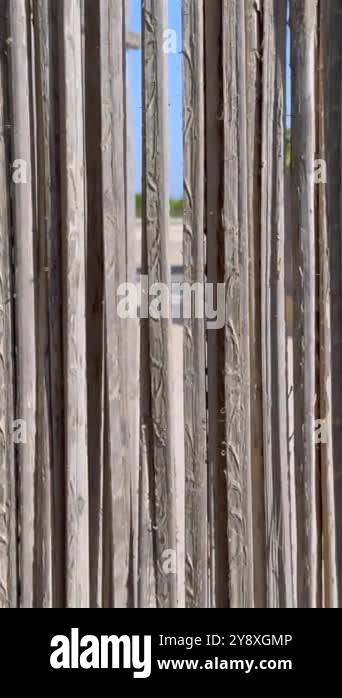 Wooden fence made from natural materials wood branches embraces ...