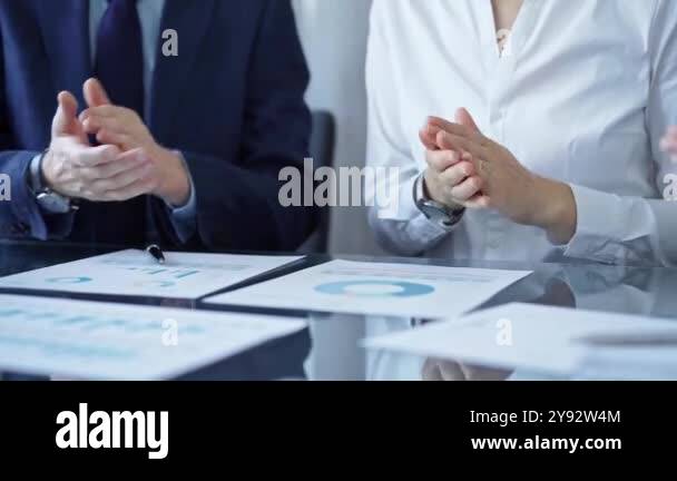 Business team clapping hands after successful presentation ...