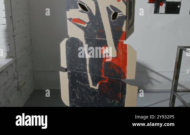 Close-up arc shot of cardboard art object on display at trendy ...