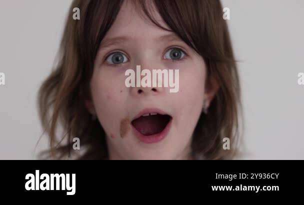 Girl with large birthmark performs range of silly and expressive faces ...